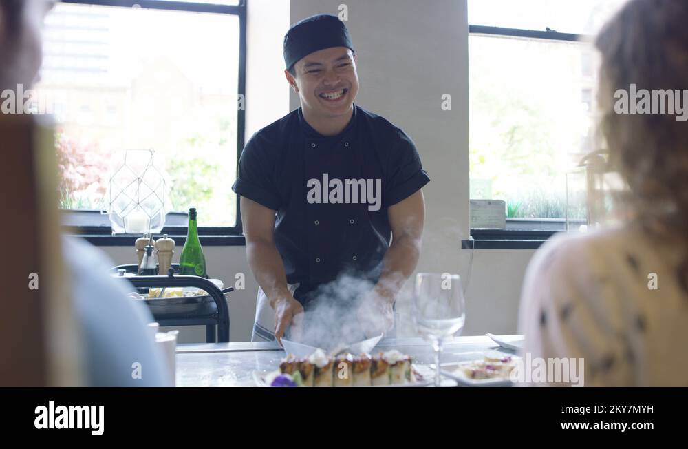 Japanese chef cooking teppanyaki food cuisine in Hibachi steak house ...