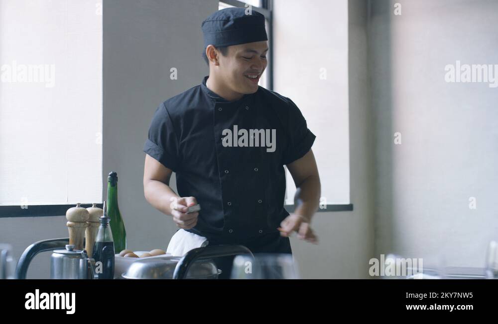 Japanese chef cooking teppanyaki food cuisine in Hibachi steak house ...