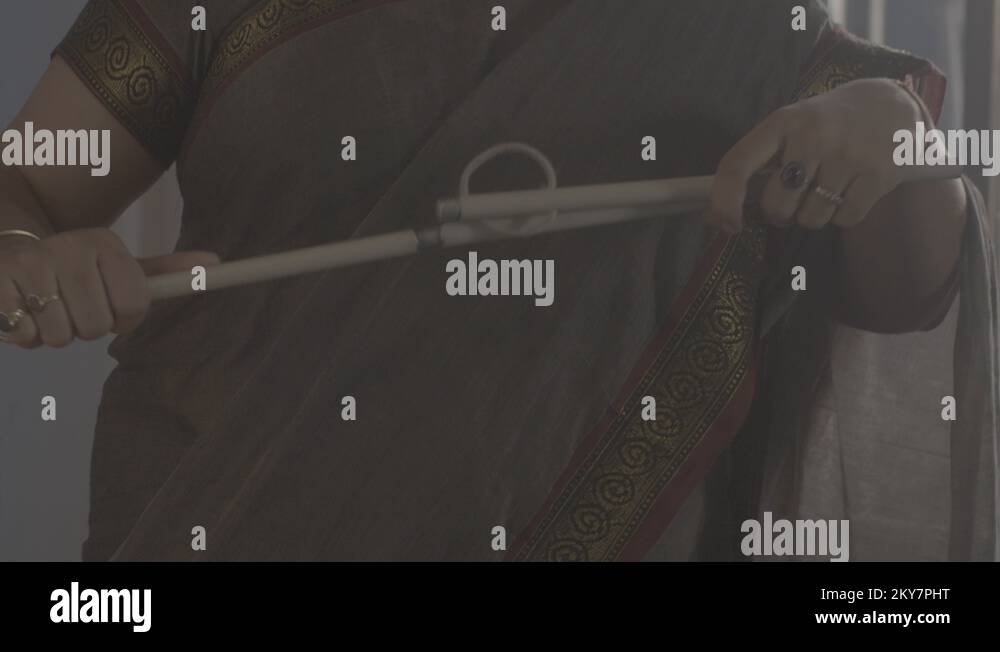 Blind indian woman in a saree folding a cane Shot on Sony FS7 Stock ...