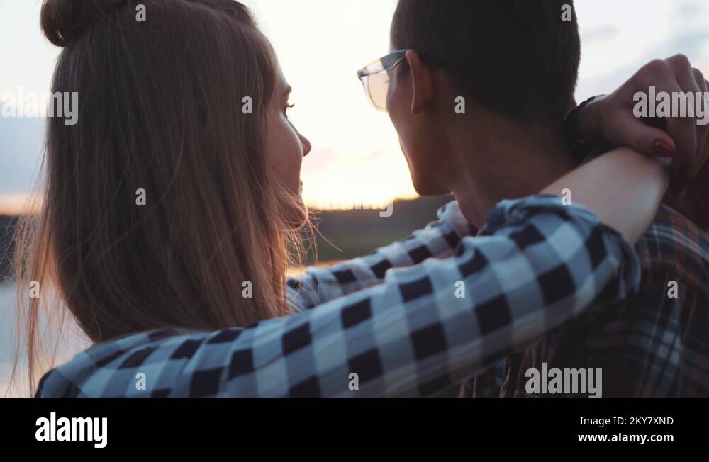 Close up view of Young Couple Hugging, looking each other in the Eyes ...