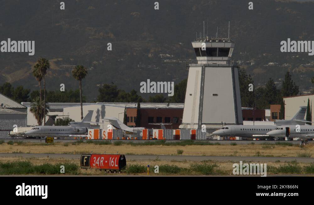 PRIVATE JET LANDS PAST CONTROL TOWER WITH HEAT WAVES IN 4K SLOW MOTION ...