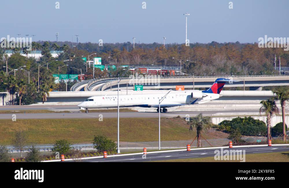Delta Connection CRJ-900 Regional Jet Taxiing at Orlando MCO Stock ...
