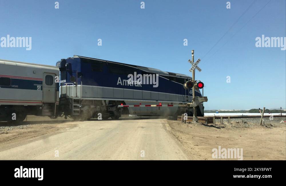 Amtrak Train Moving Through a Railroad Crossing in Central California ...