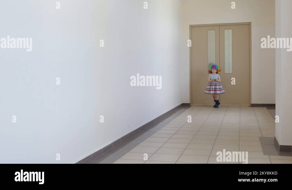 Girl of four years is not behaving properly in the corridor Stock Video ...