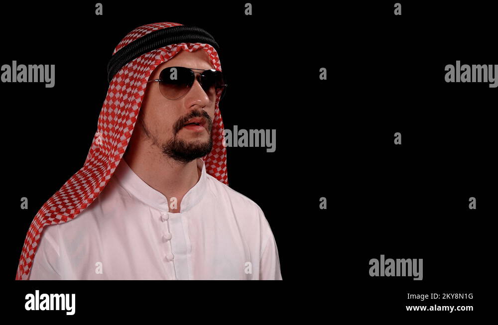 Arab in national costume raises a leaf with the inscription of the ...