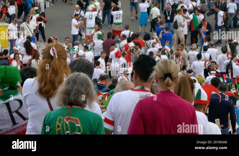 Crowd of Iran football fans going coming out of the stadium with flag ...