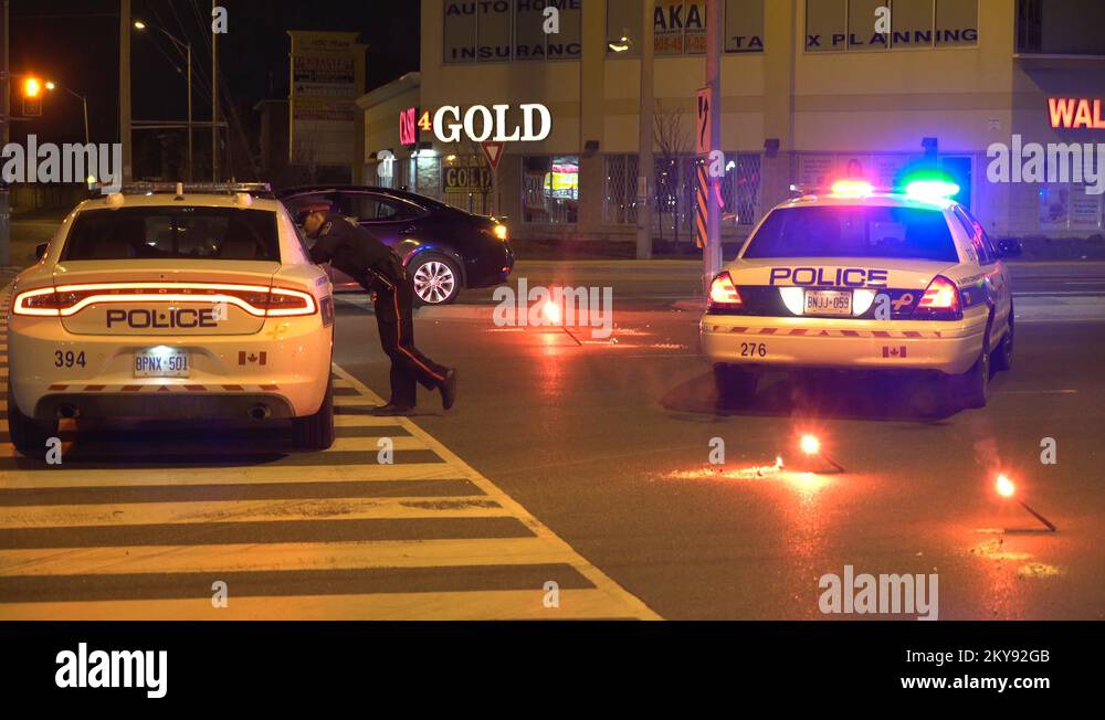 Police officer leaning on cop car with flares at night - 24fps 1080p ...