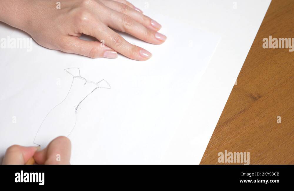 Slow motion . 4k, close-up, top view. a female hand draws with a pencil ...