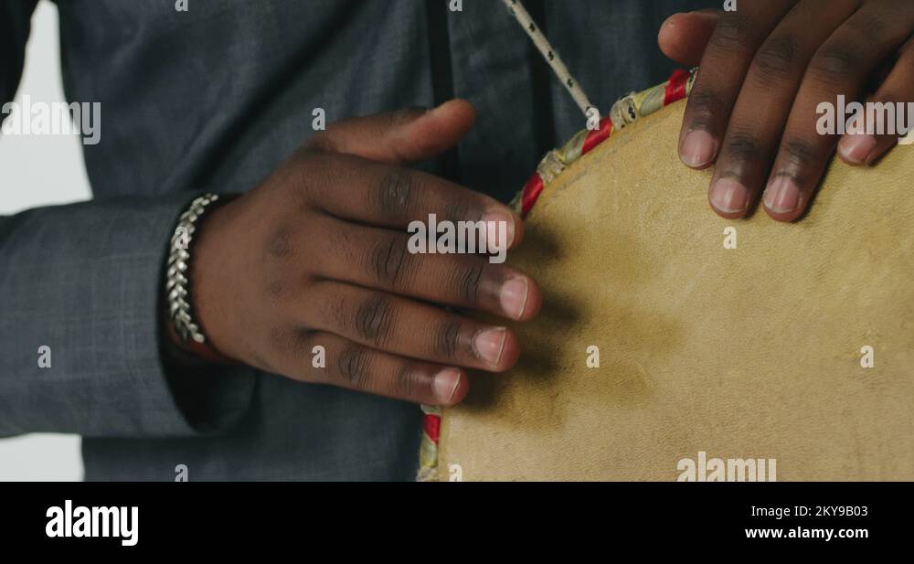 Close-up African’s hands playing on djembe drum Stock Video Footage - Alamy