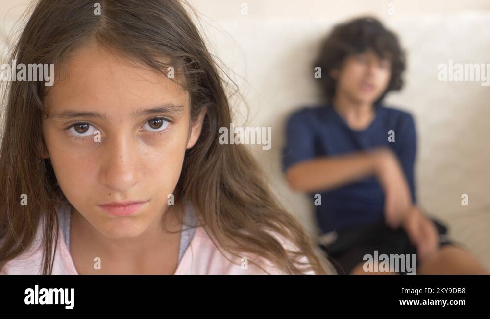 teenagers, twins, brother and sister quarrel, sitting on the couch. 4k ...