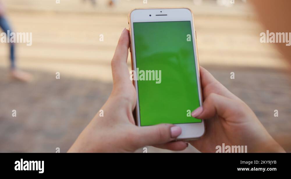 Close up woman hand holding use mobile smart phone with vertical green screen Stock Video ...