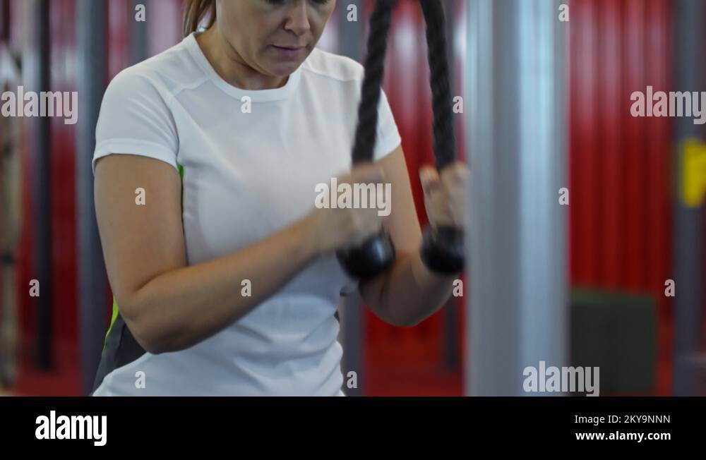 Woman Doing Triceps Pushdown Exercise Stock Video Footage - Alamy