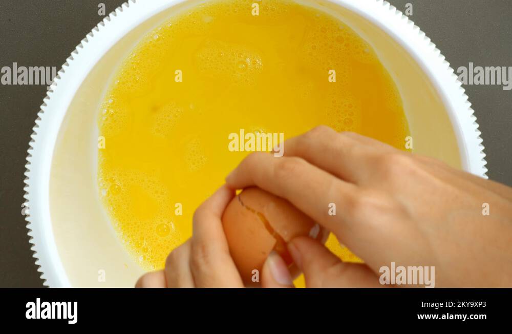 Hand breaking egg Stock Videos & Footage - HD and 4K Video Clips - Alamy