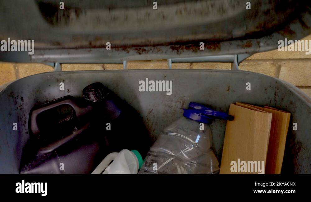 Recyclable waste dropping into a recycling / recyclable bin Stock Video ...