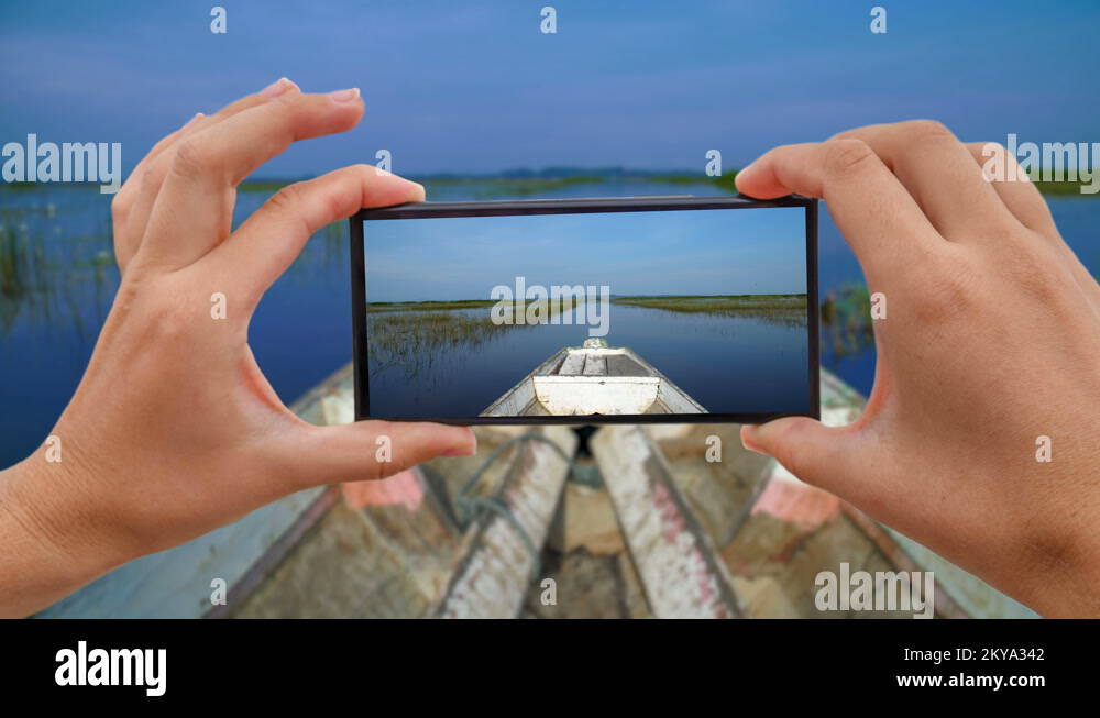 Cinemagraph of Taking Mobile Photo of Riding Boat at Inle Lake in Sunny ...