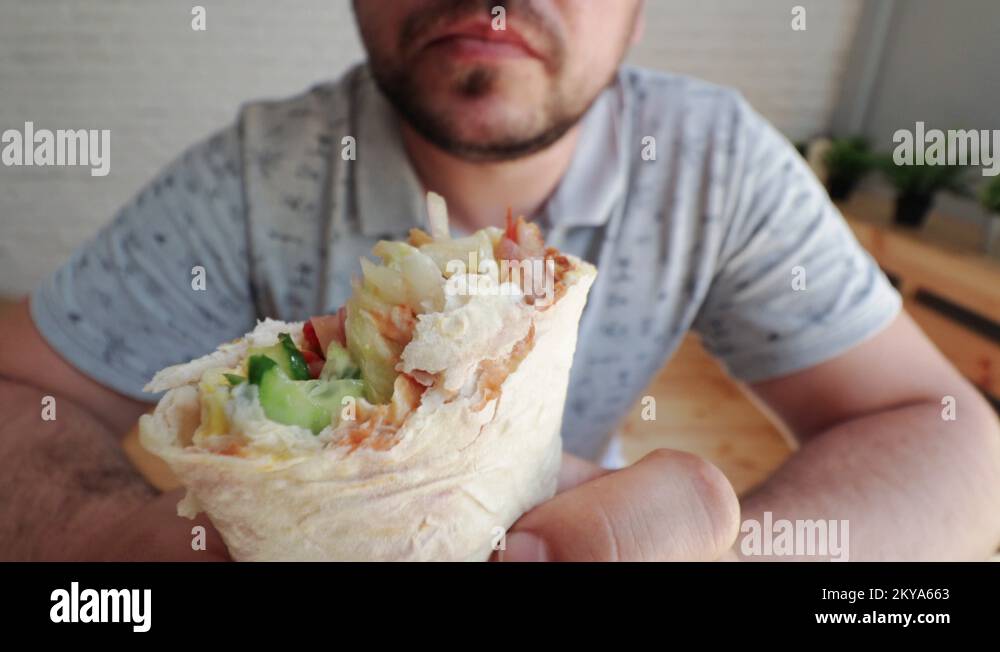 Man eating Doner Kebap its a midlle eastern fast food cuisine Stock ...