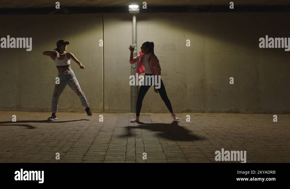 dancing woman young hip hop dancer girls under street light practicing ...