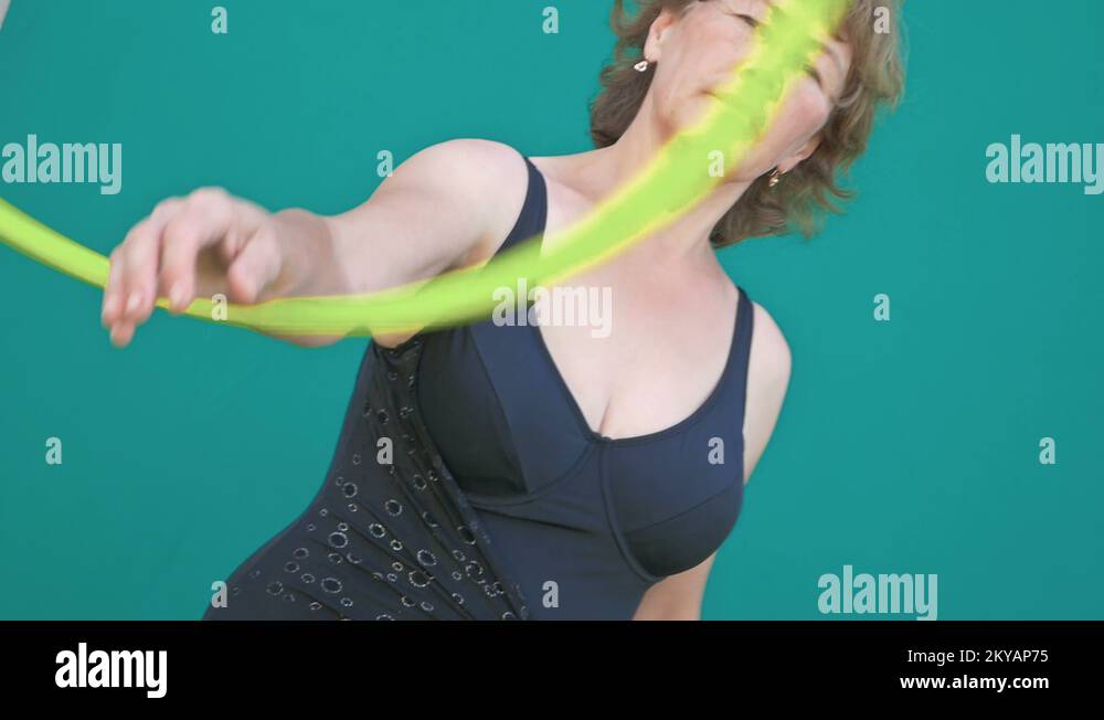 handsome-60-years-old-women-are-smiling-she-twists-a-hoop-on-her-hand
