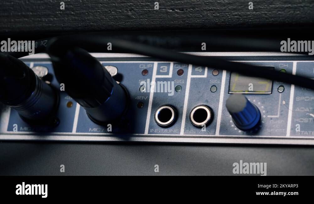 Surface of sound card in recording studio. The cords are connected to ...