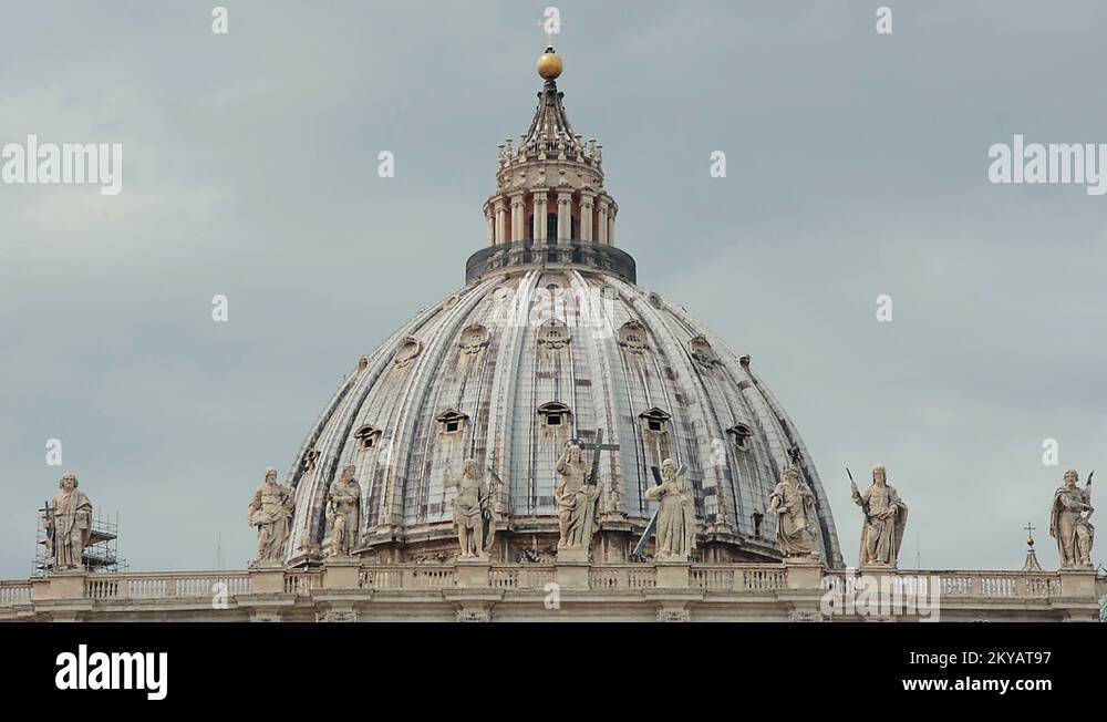 The St. Peters Basilica Dome and Apostles stone statues in Vatican City ...