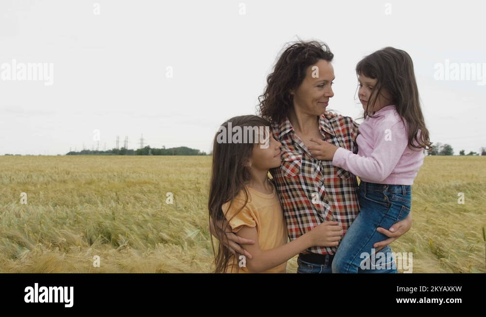 Happy family in the rain. Woman with children in a wheat field Stock ...