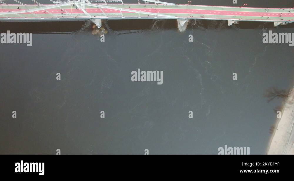 Aerial top down view of people walk in pedestrian bridge over the ...