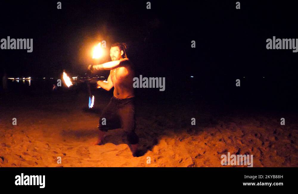 Man Juggling With Fire On Fire Show At Night On Beach Stock Video ...