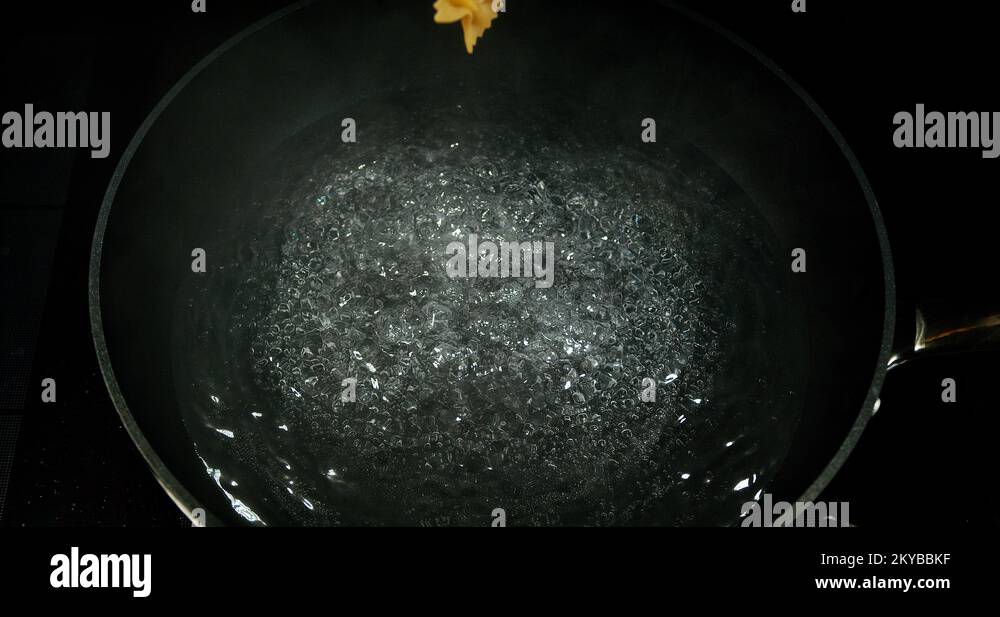 Pasta falling into boiling water, Slow motion 4K Stock Video Footage ...
