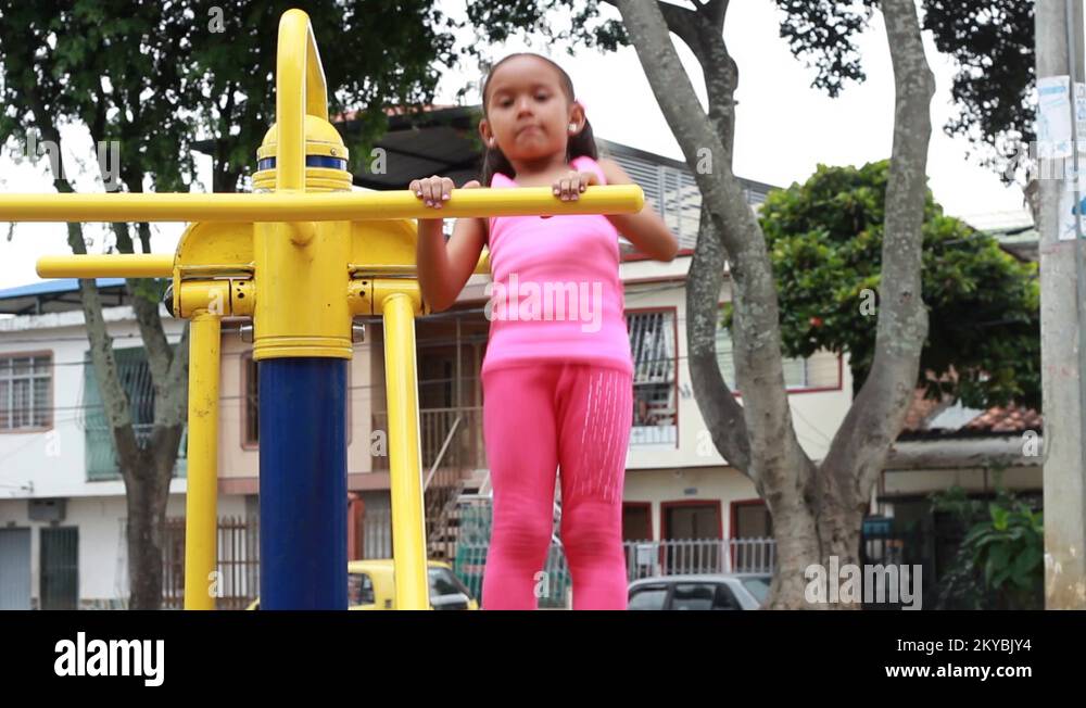 Little girl on double pendulum swing Medium Shot 2 Stock Video Footage - Alamy