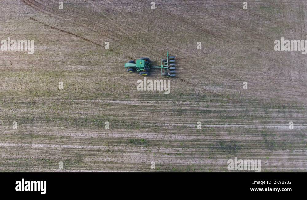 tractor on farming plowing from above drone Stock Video Footage - Alamy