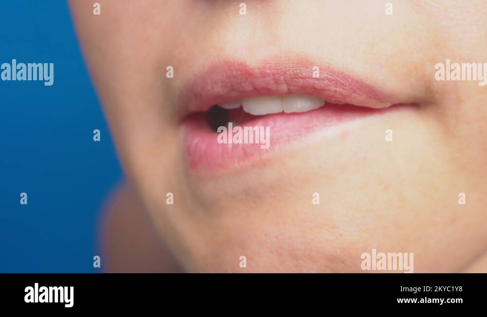 close-up, female lips without makeup, on a blue background. 4k, slow ...