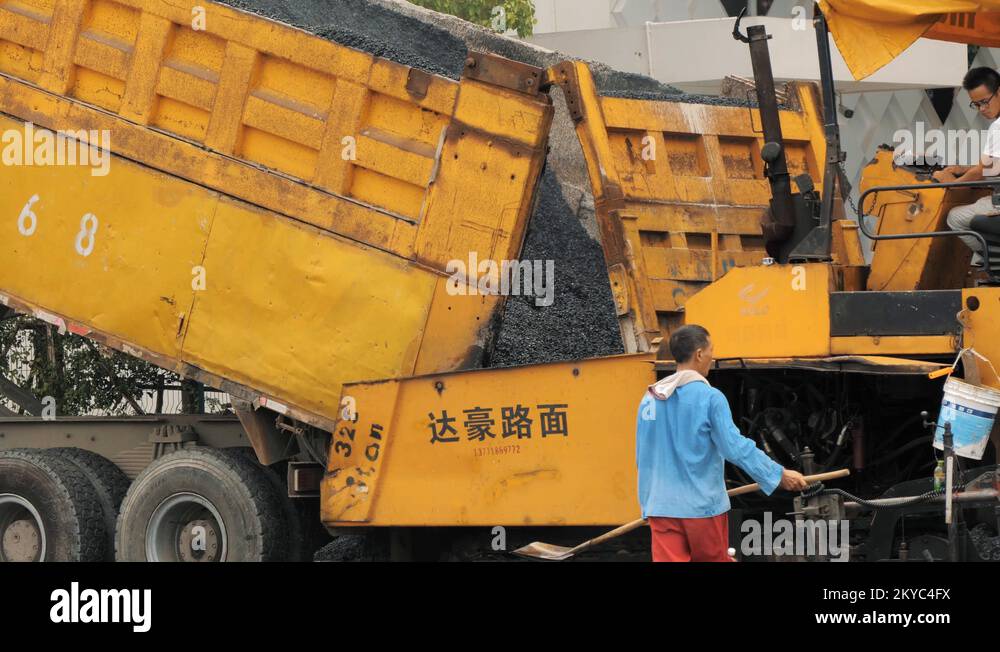 Pavement machine laying fresh asphalt Stock Videos & Footage - HD and ...