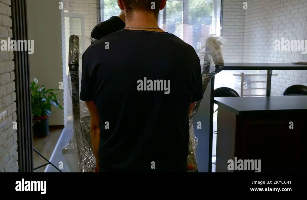 Men carrying table Stock Videos & Footage - HD and 4K Video Clips - Alamy