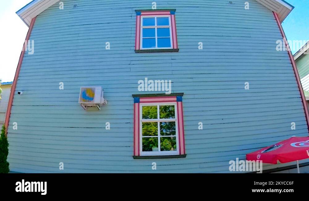 A big blue house with the three glass windows on the front Stock Video ...