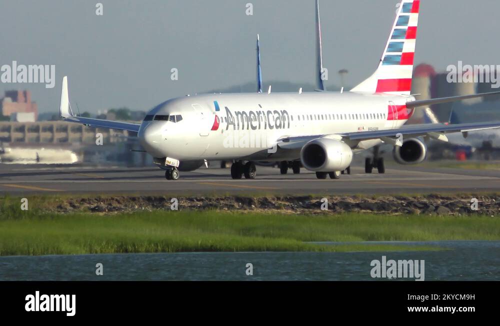 4K American Airlines plane turns to airport runway, Boston harbor ...