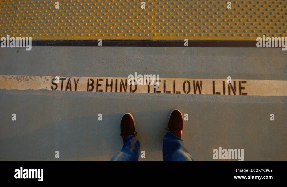 Standing behind yellow line Stock Videos & Footage - HD and 4K Video ...