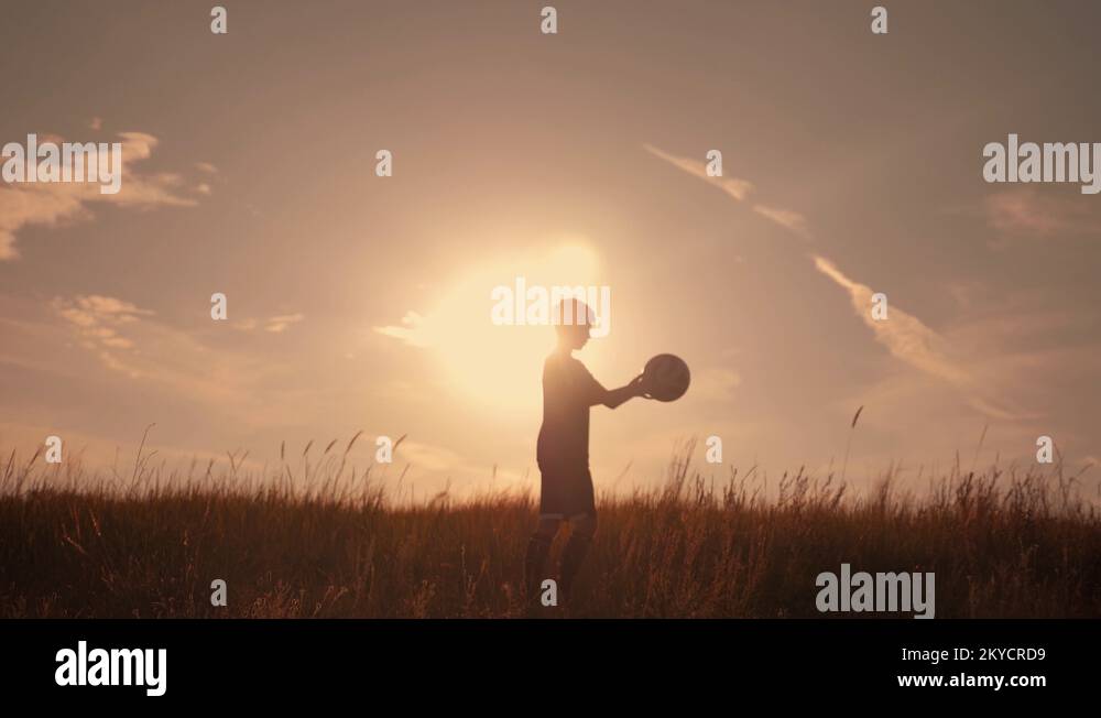 Boy playing football sunset silhouette Stock Videos & Footage - HD and ...