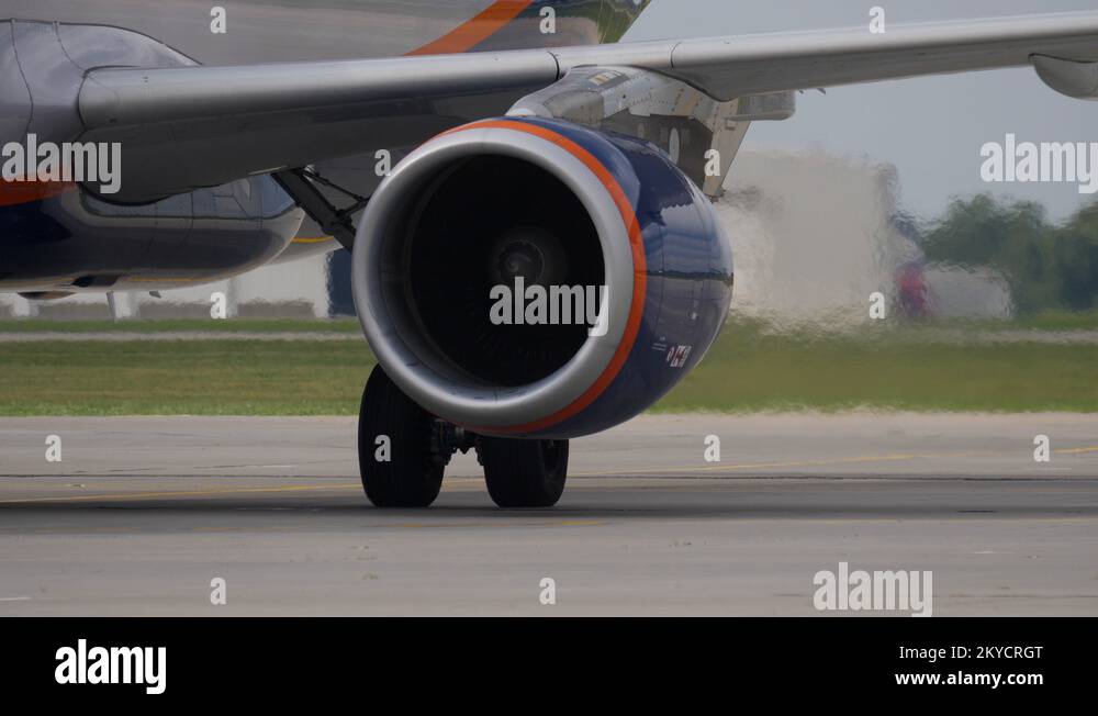 Working jet engine of a passenger airliner producing heat haze behind ...