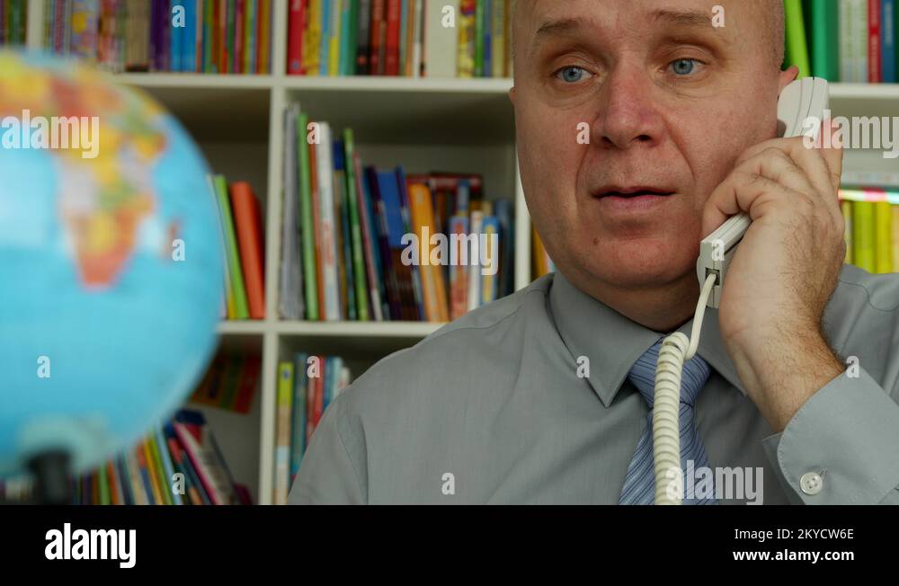 Businessman Looking on Earth Map Talk to Telephone Using Office ...