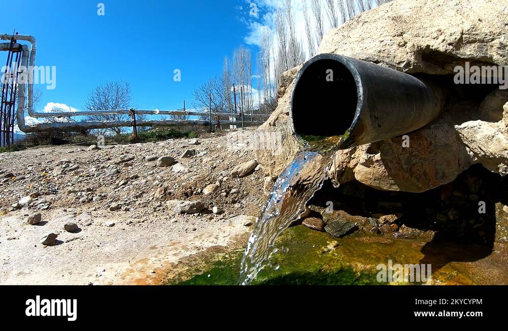 Mineral water spring tap. Old stone ecological clean drinking water tap ...
