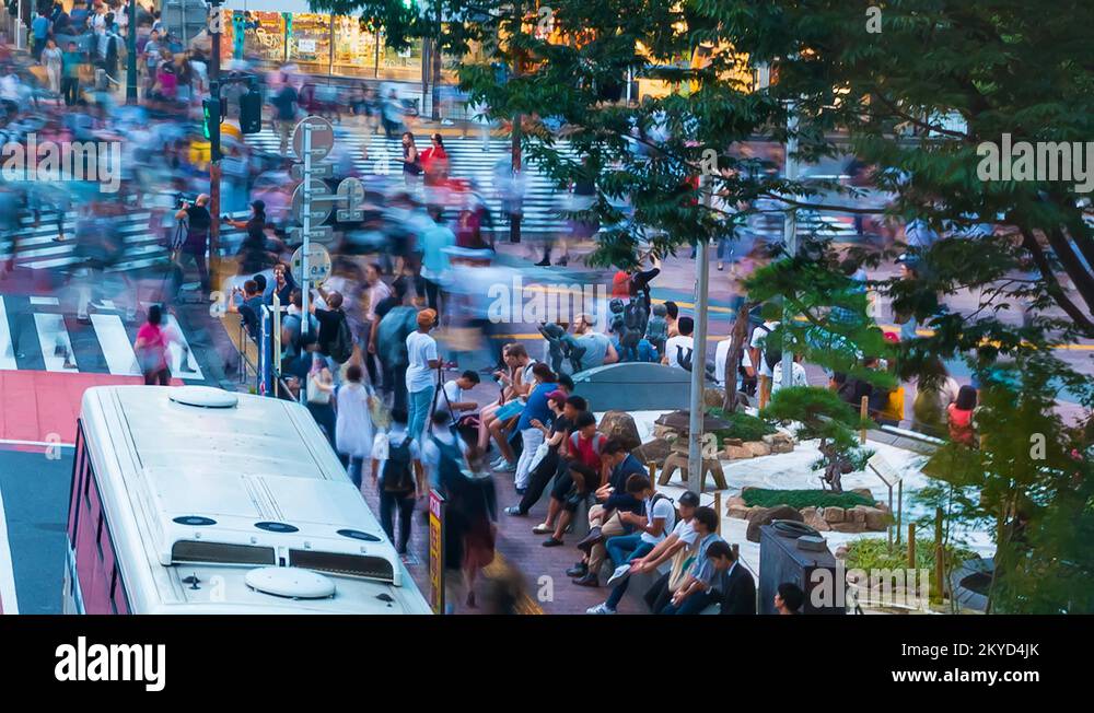People cross the famous intersection in Shibuya, Tokyo Stock Video ...