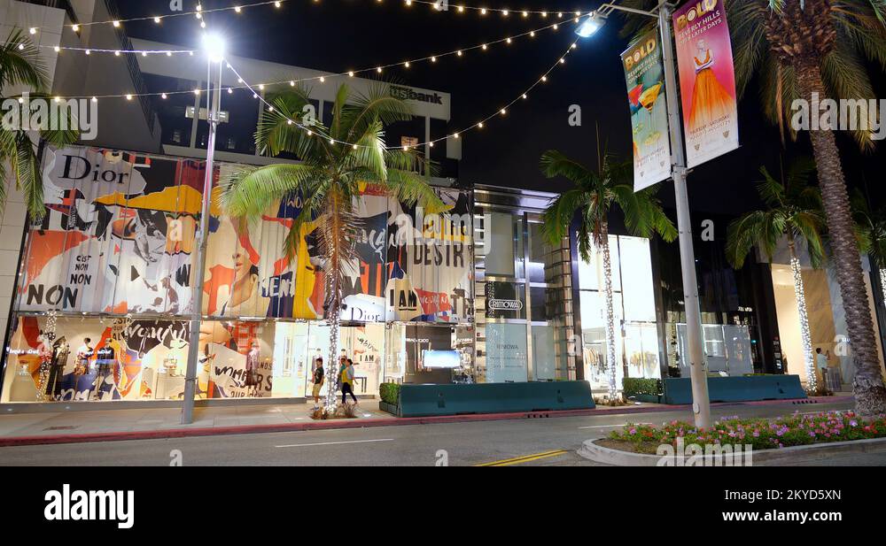 Cars driving on Rodeo Drive near Dior store in Beverly Hills Los ...