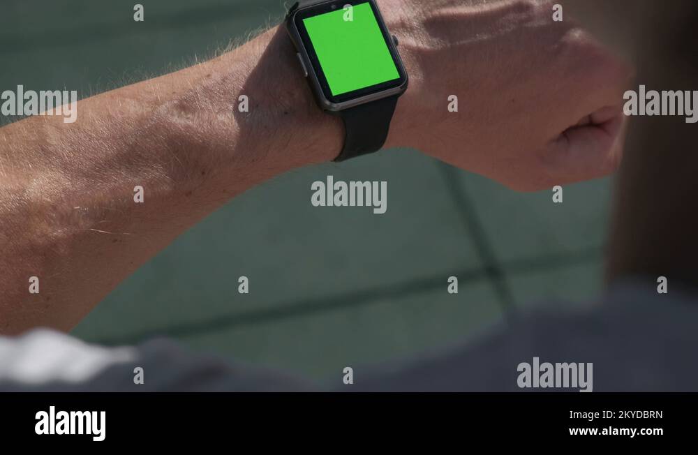 Close up of an Athletic mans hands with smartwatch green screen chroma ...