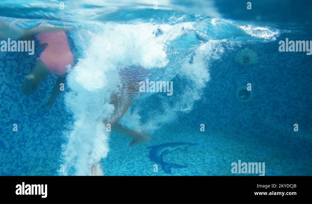 Underwater 4k footage of two teenage girls jumping and diving in ...