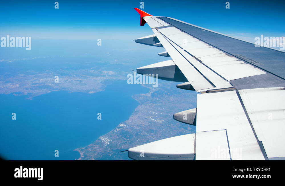 4k footage from the illuminator on jet airplane wing flying above ...