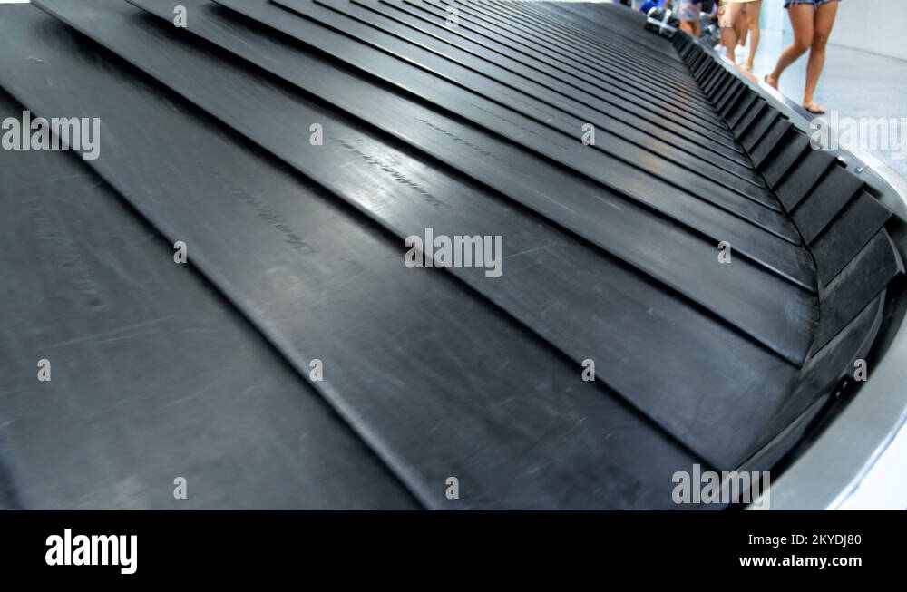 Closeup 4k video of empty luggage conveyor belt at arrival airport ...