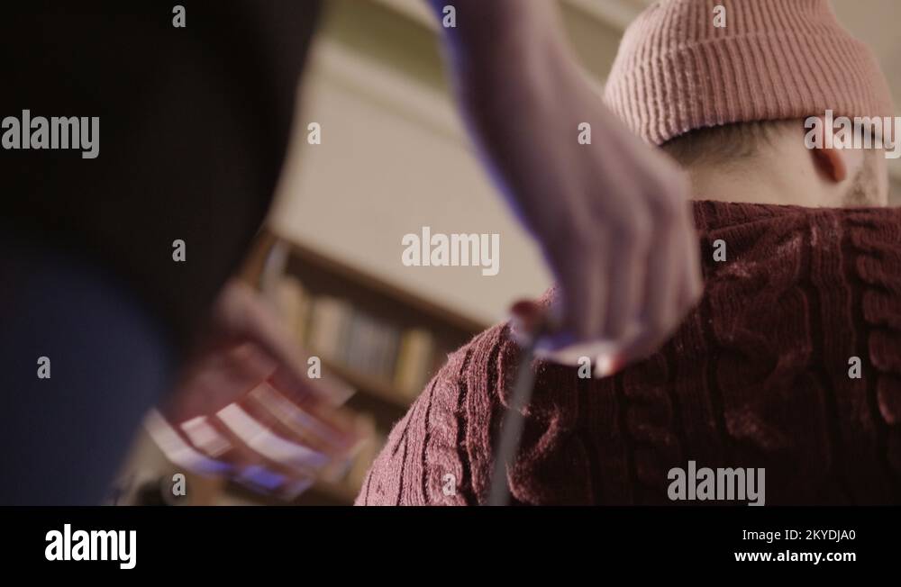 Mature guy with D-sub cable hanging from inside of his nape is getting ...