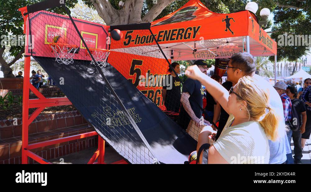 People throwing ball in basket at Mexican cultural festival in Los ...