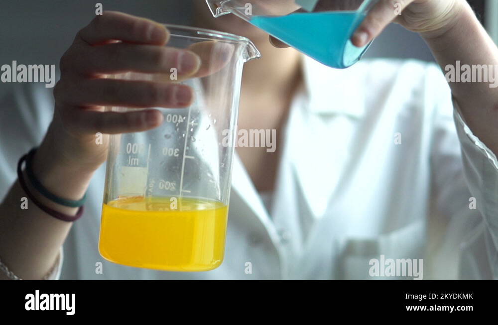 Teenage girl scientist mixing chemicals in beaker Stock Video Footage ...