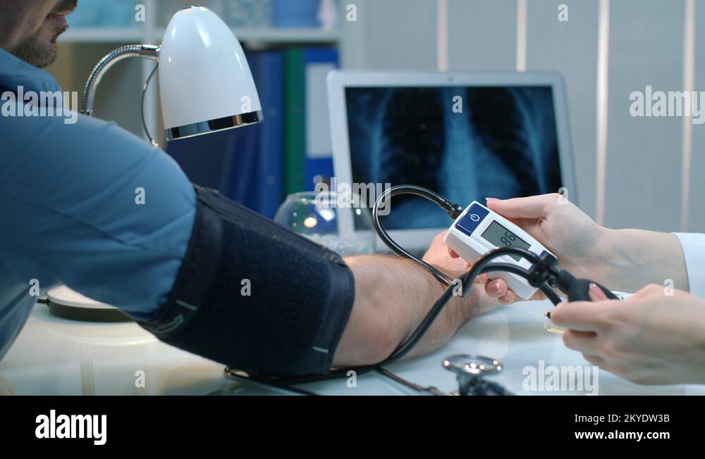 Nurse pressure measure man. Female doctor check arterial pressure Stock ...